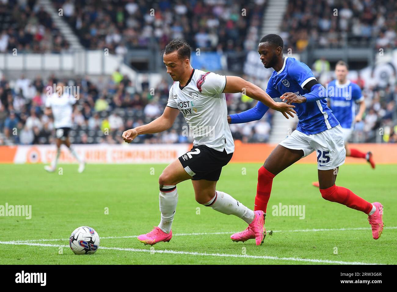 Kane Wilson of Derby County shields the ball from Abu Kamara of ...