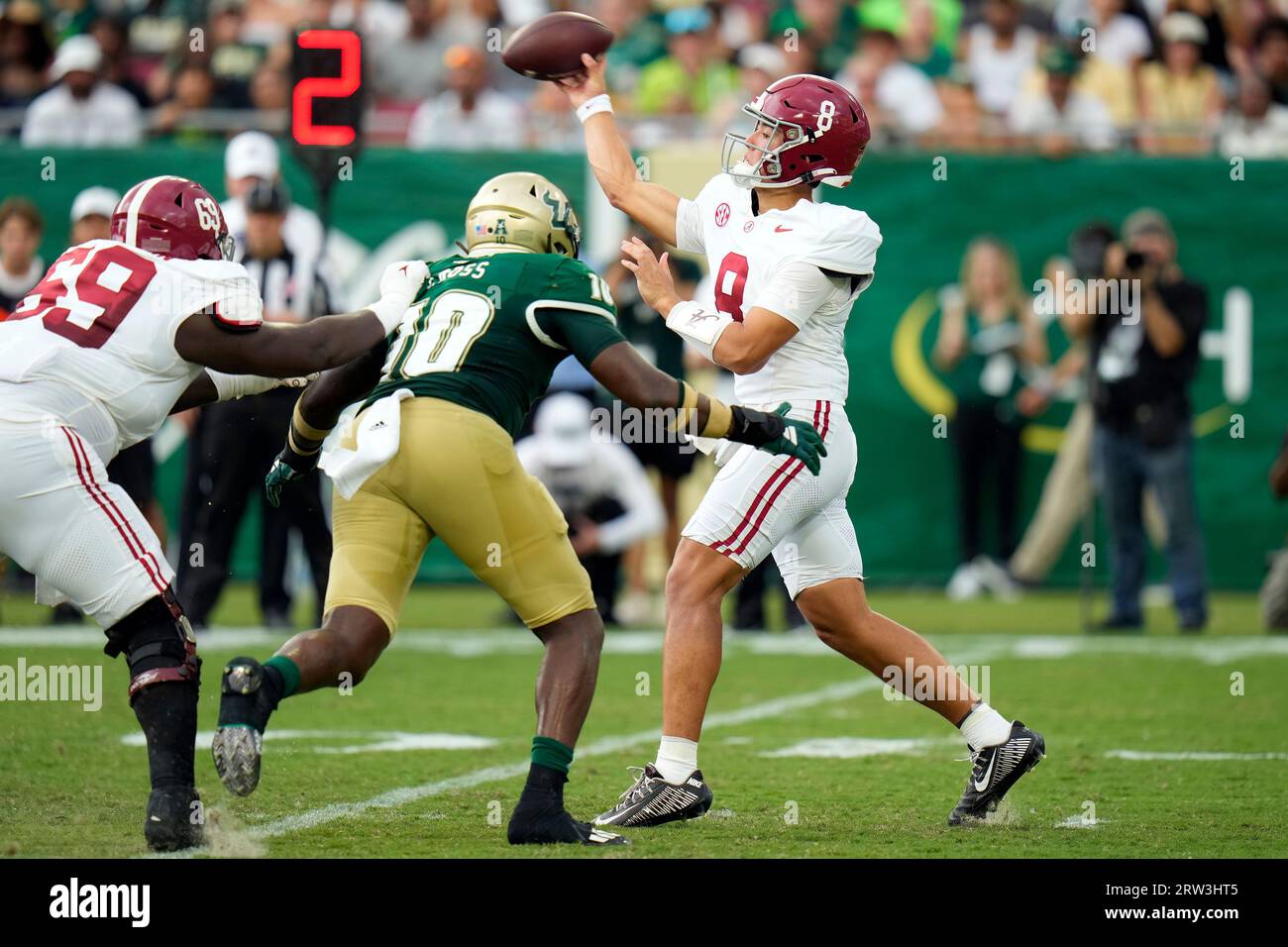 Alabama quarterback Tyler Buchner (8) gets hit by South Florida ...