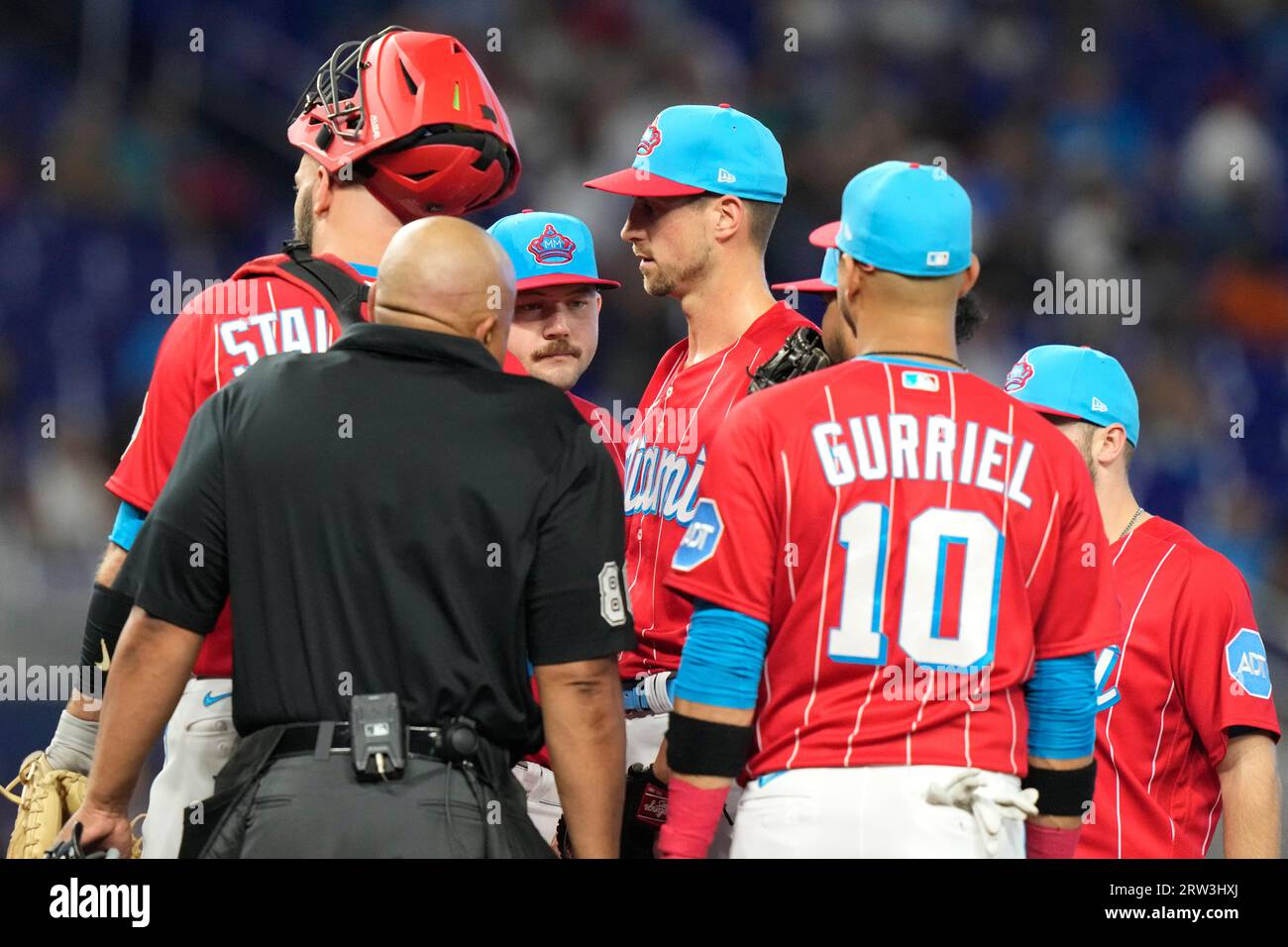Miami Marlins starting pitcher Bryan Hoeing meets on the mound during ...