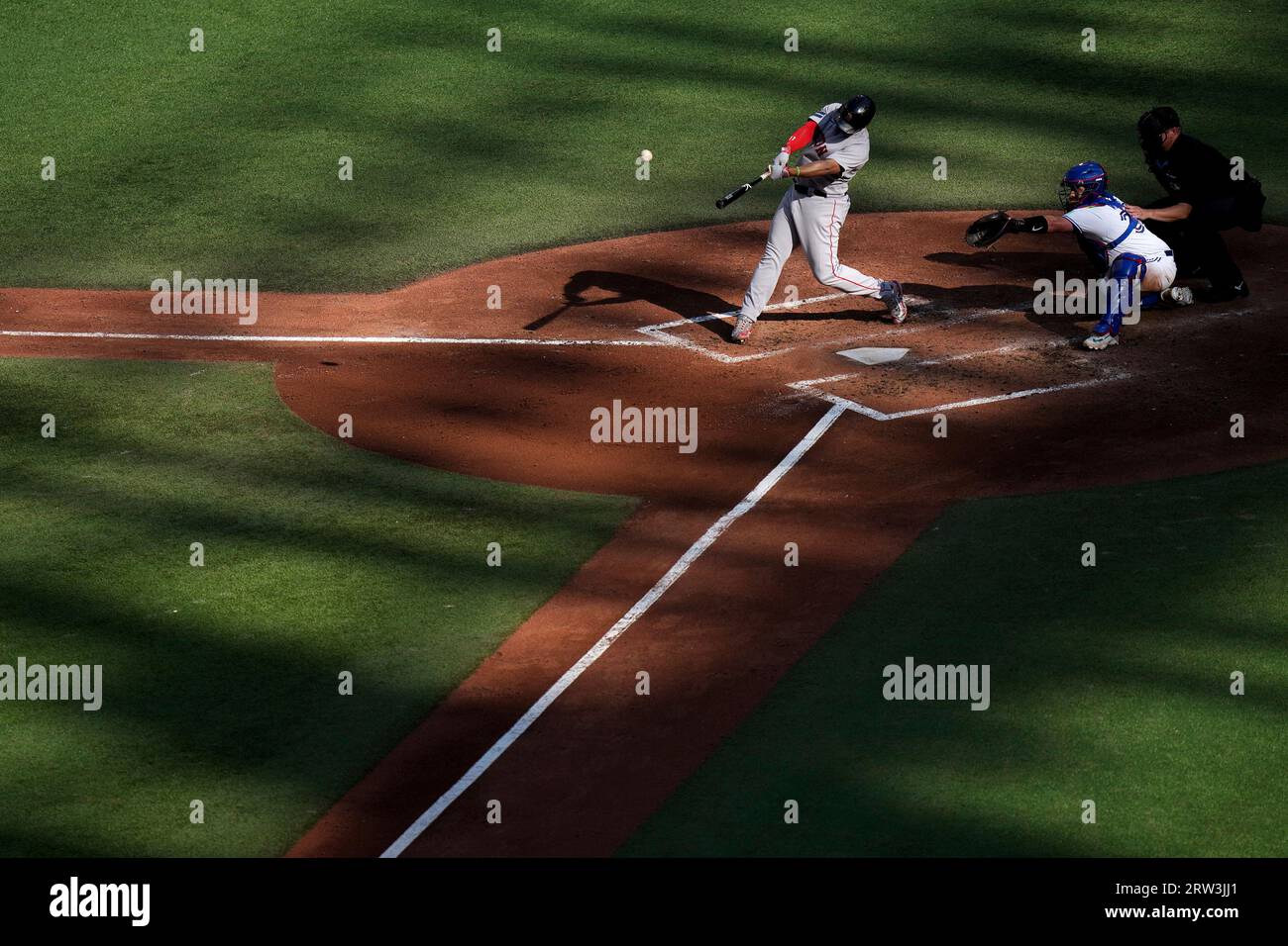 Boston Red Sox's Rafael Devers, left, hits a two-run home run in front ...
