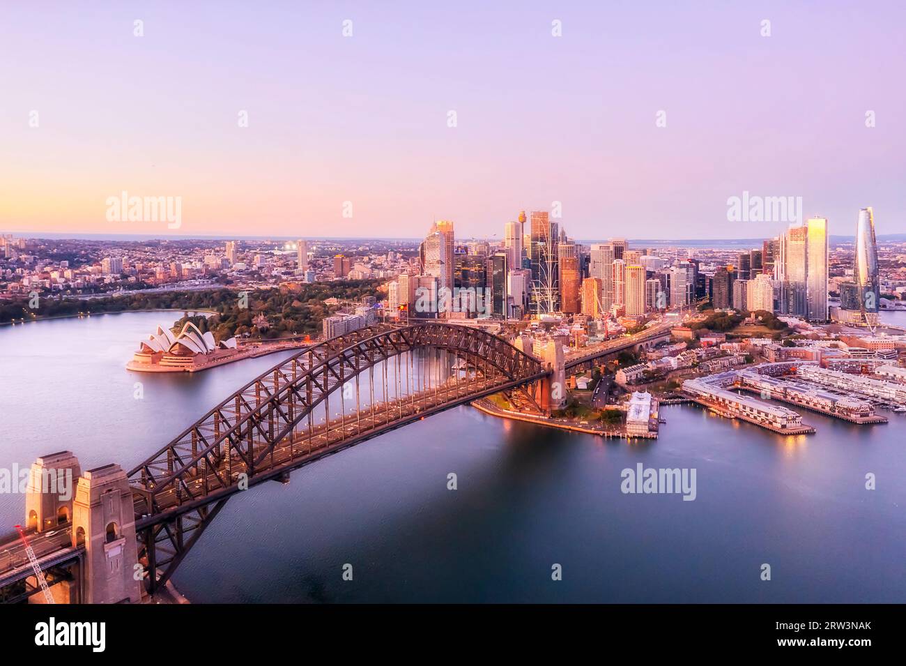 Sydney Harbour bridge across City of Sydney harbour in aerial cityscape ...