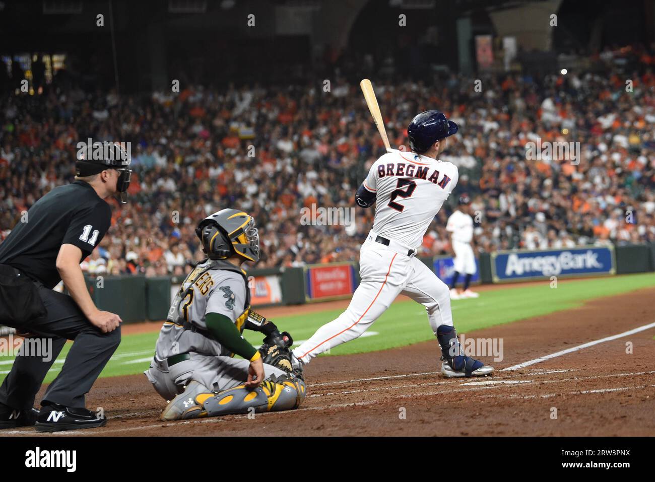 Houston Astros third baseman Alex Bregman (2) follows through on a 358 ...
