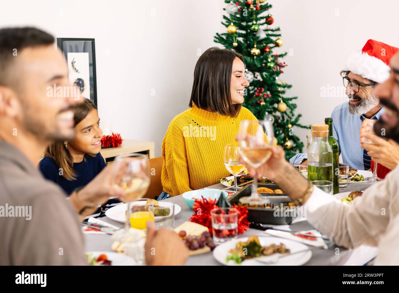 Happy large multi generational family enjoying dinner christmas ...