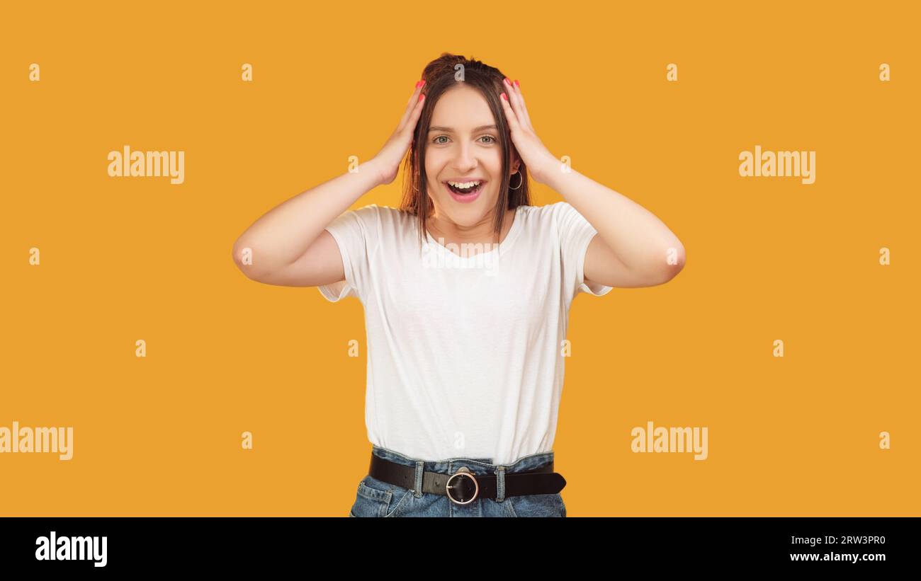 Shock emotion surprised woman hands covering head Stock Photo - Alamy