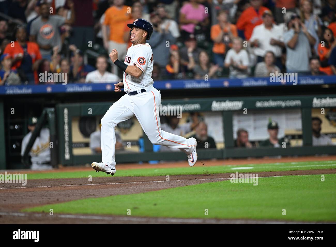 Houston Astros designated hitter Michael Brantley (23) scores during ...
