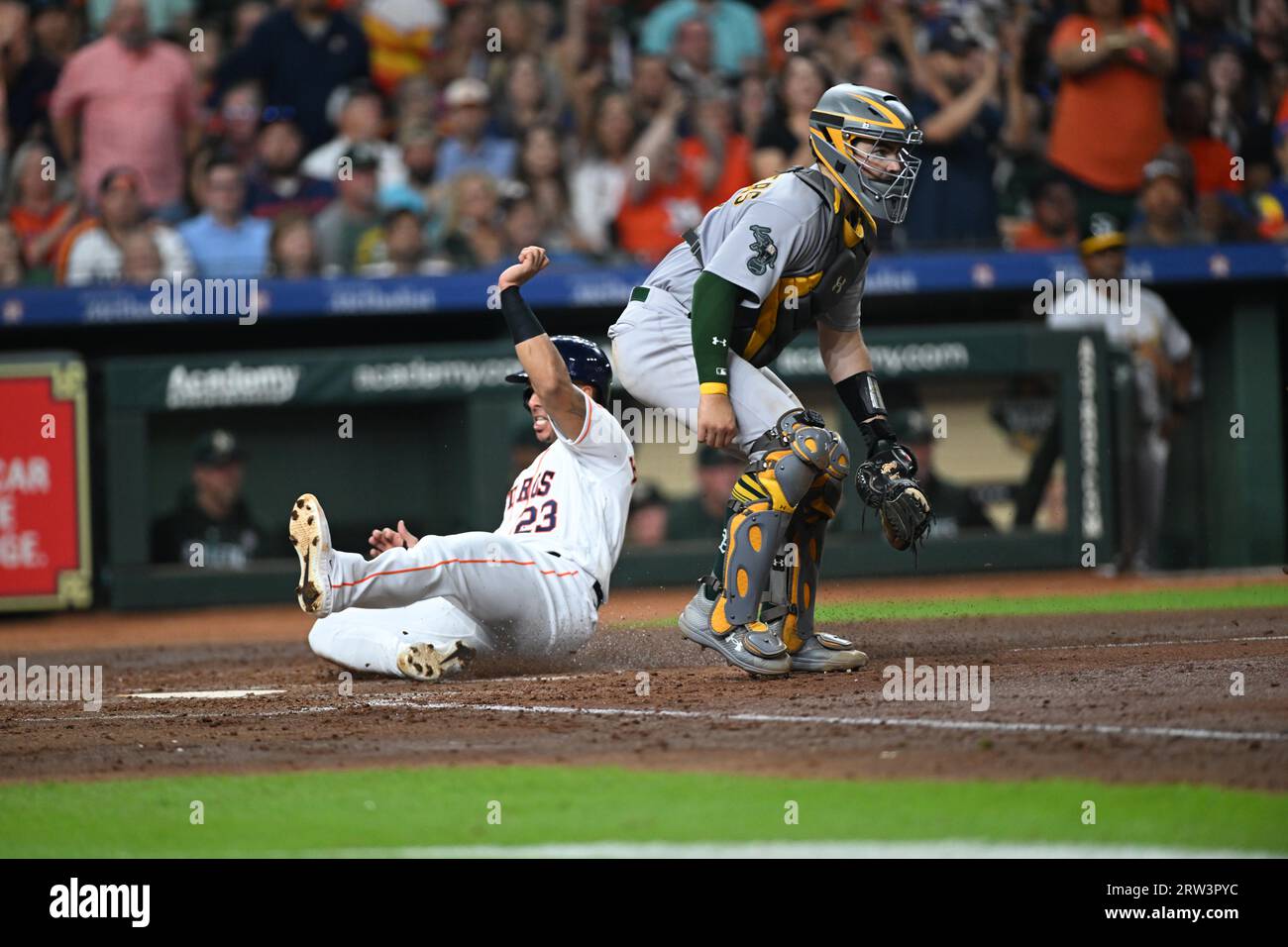 Houston Astros designated hitter Michael Brantley (23) slides safe into ...