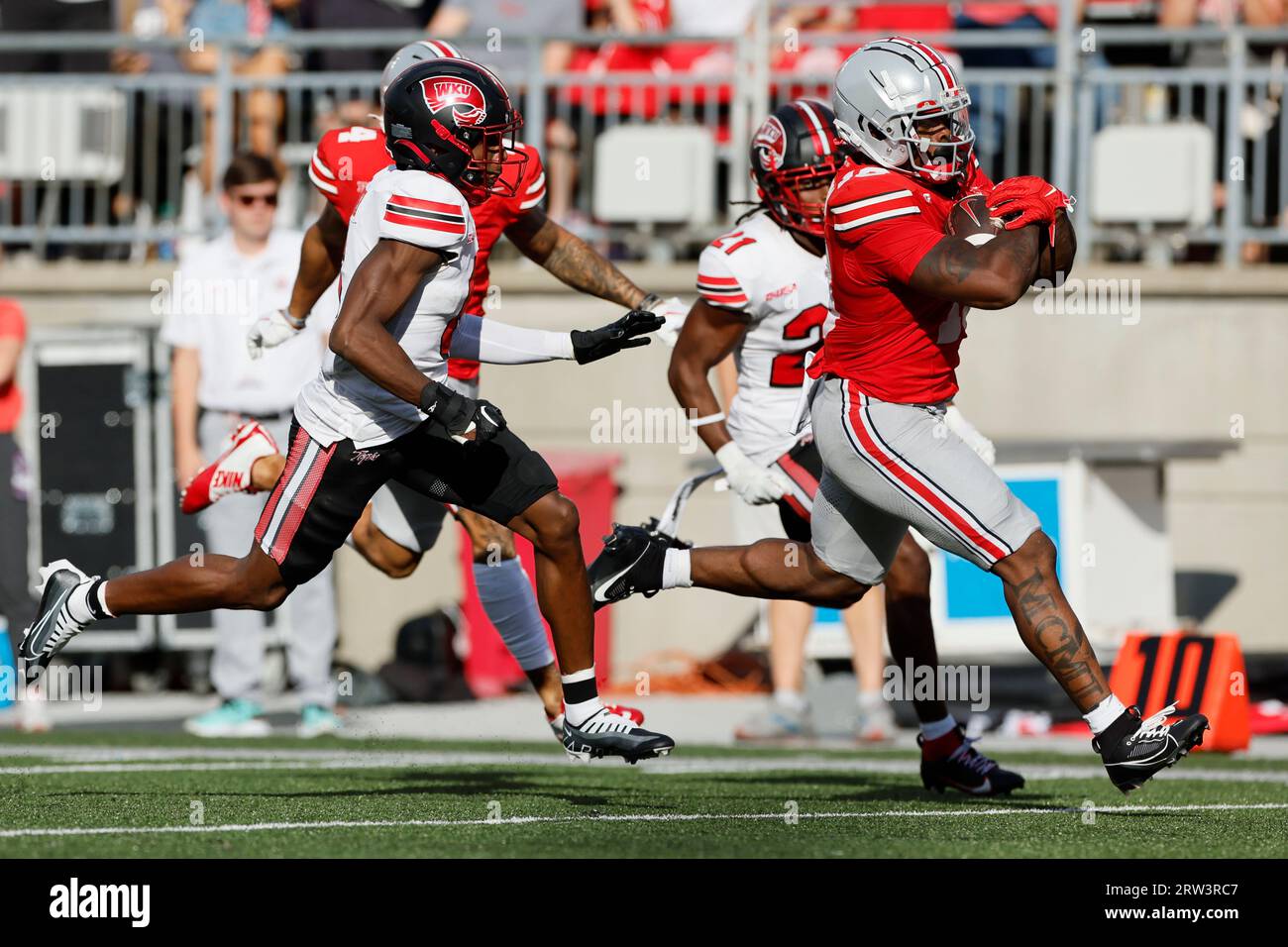 Ohio State running back Chip Trayanum, right, scores a touchdown past ...