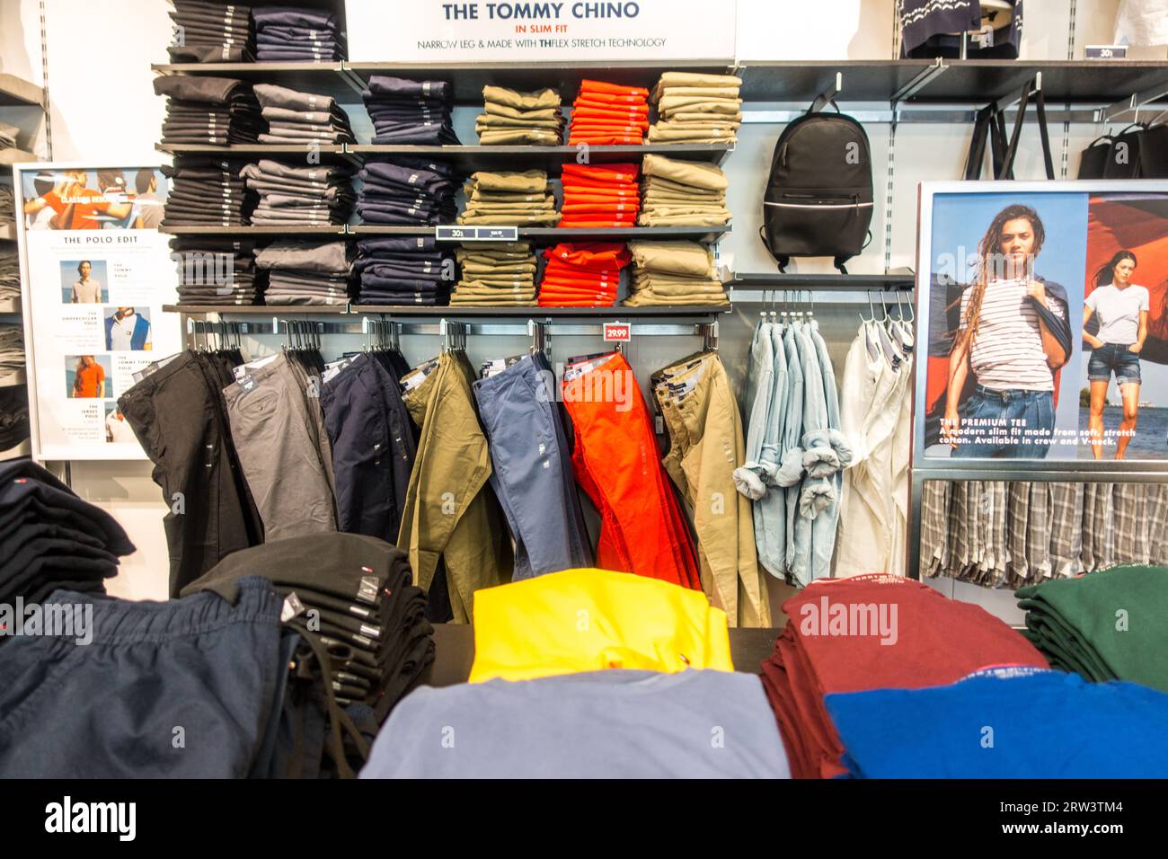 Adult men trousers on display in store Stock Photo - Alamy