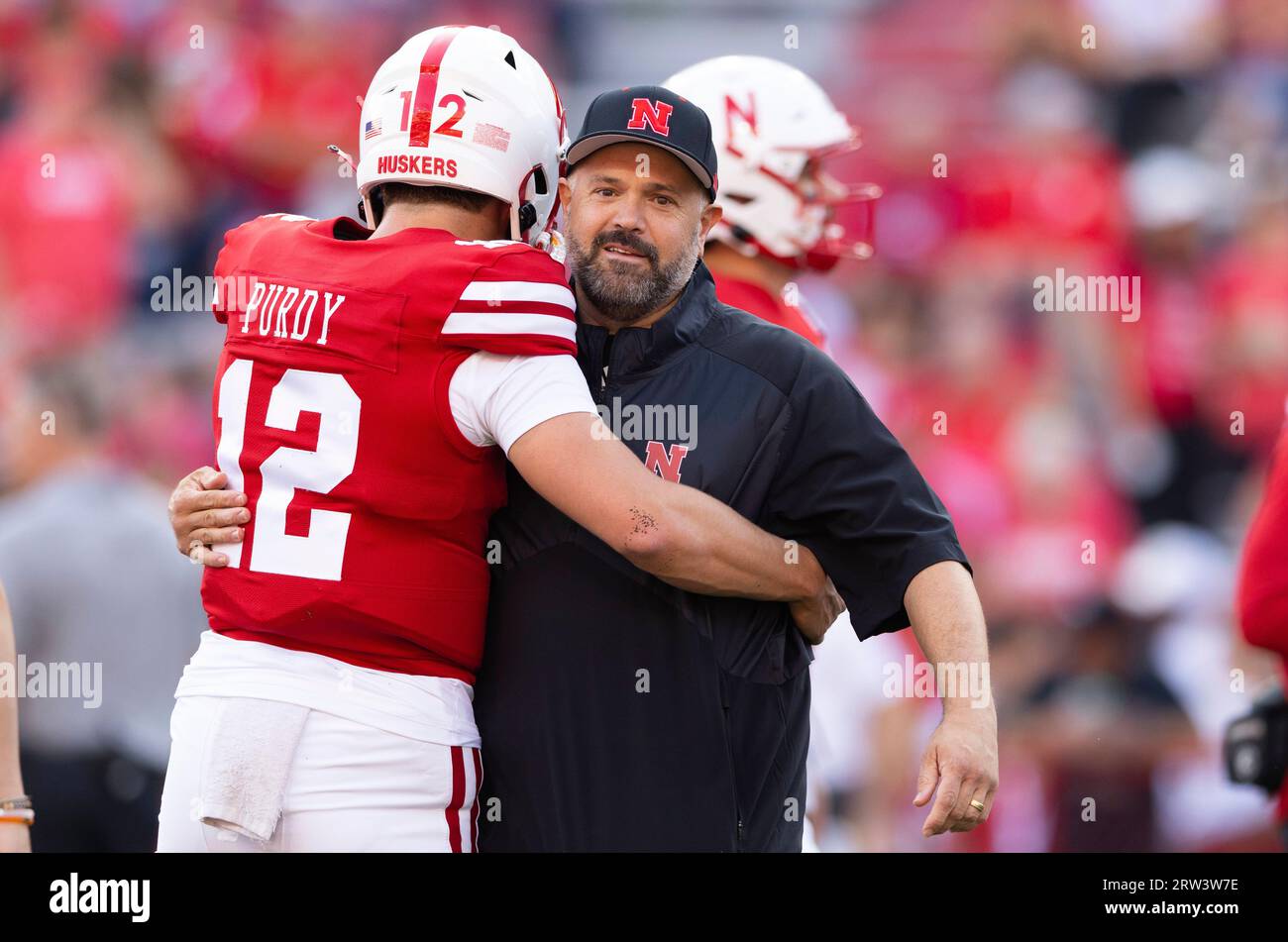 Nebraska quarterback Chubba Purdy (12) hugs head coach Matt Rhule ...