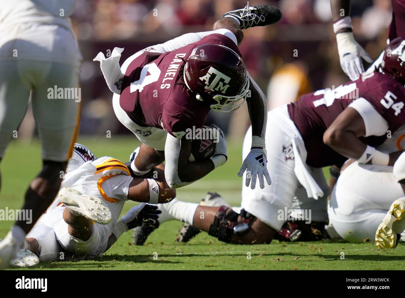 Texas A&M running back Amari Daniels (4) is stopped short of a first ...