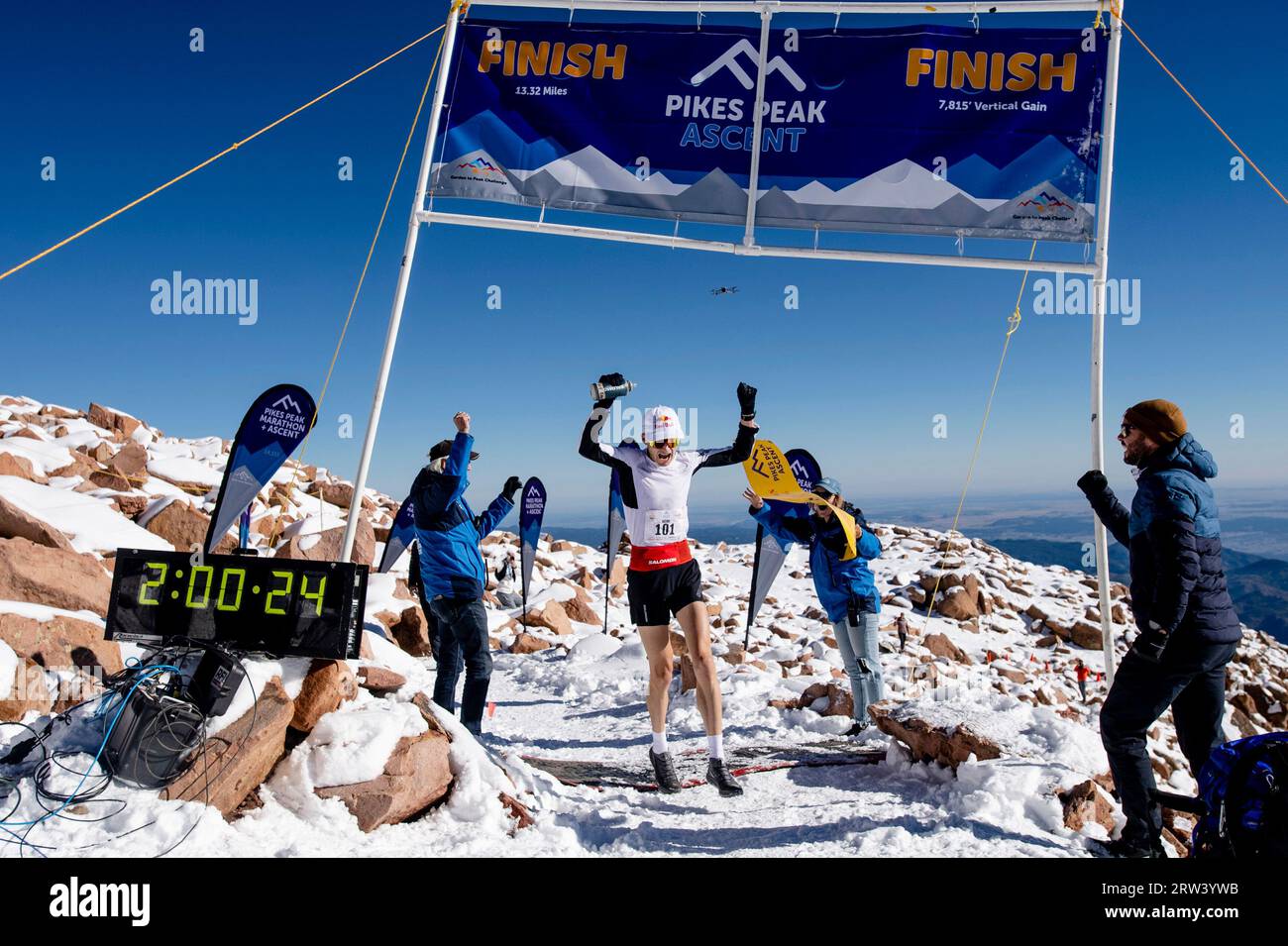 Swiss runner Rémi Bonnet cheers as he crosses the finish line, breaking ...