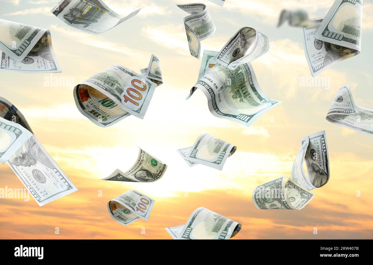 Dollar banknotes falling from sky Stock Photo - Alamy