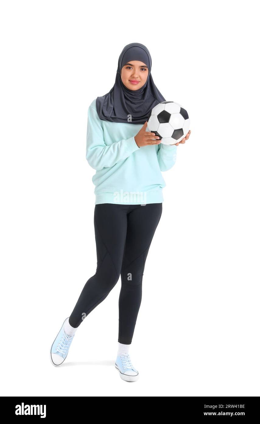 Young Muslim woman with soccer ball on white background Stock Photo - Alamy