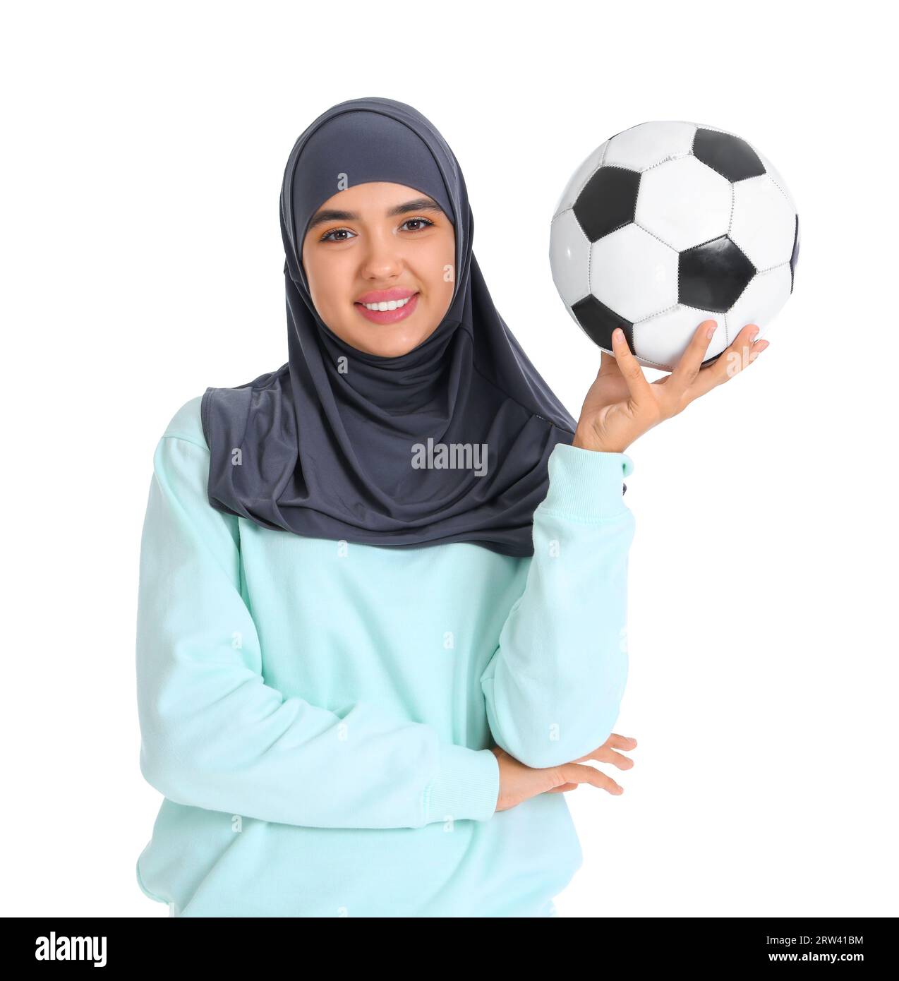 Young Muslim woman with soccer ball on white background Stock Photo - Alamy