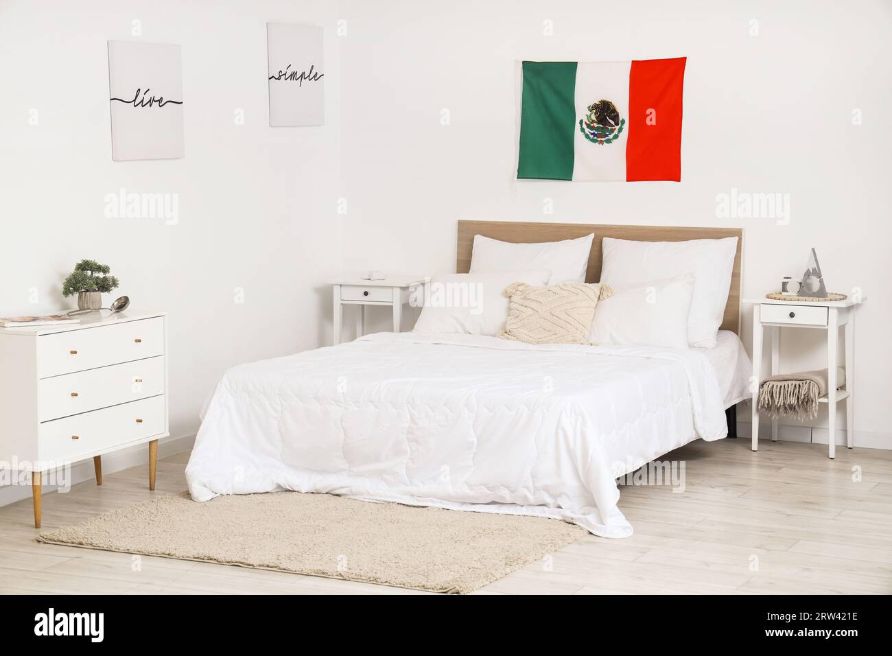 Interior of bedroom with tables and hanging Mexican flag Stock Photo ...