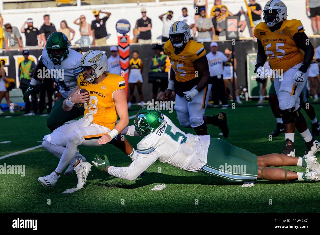 Southern Mississippi quarterback Billy Wiles (8) slides for no gain ...