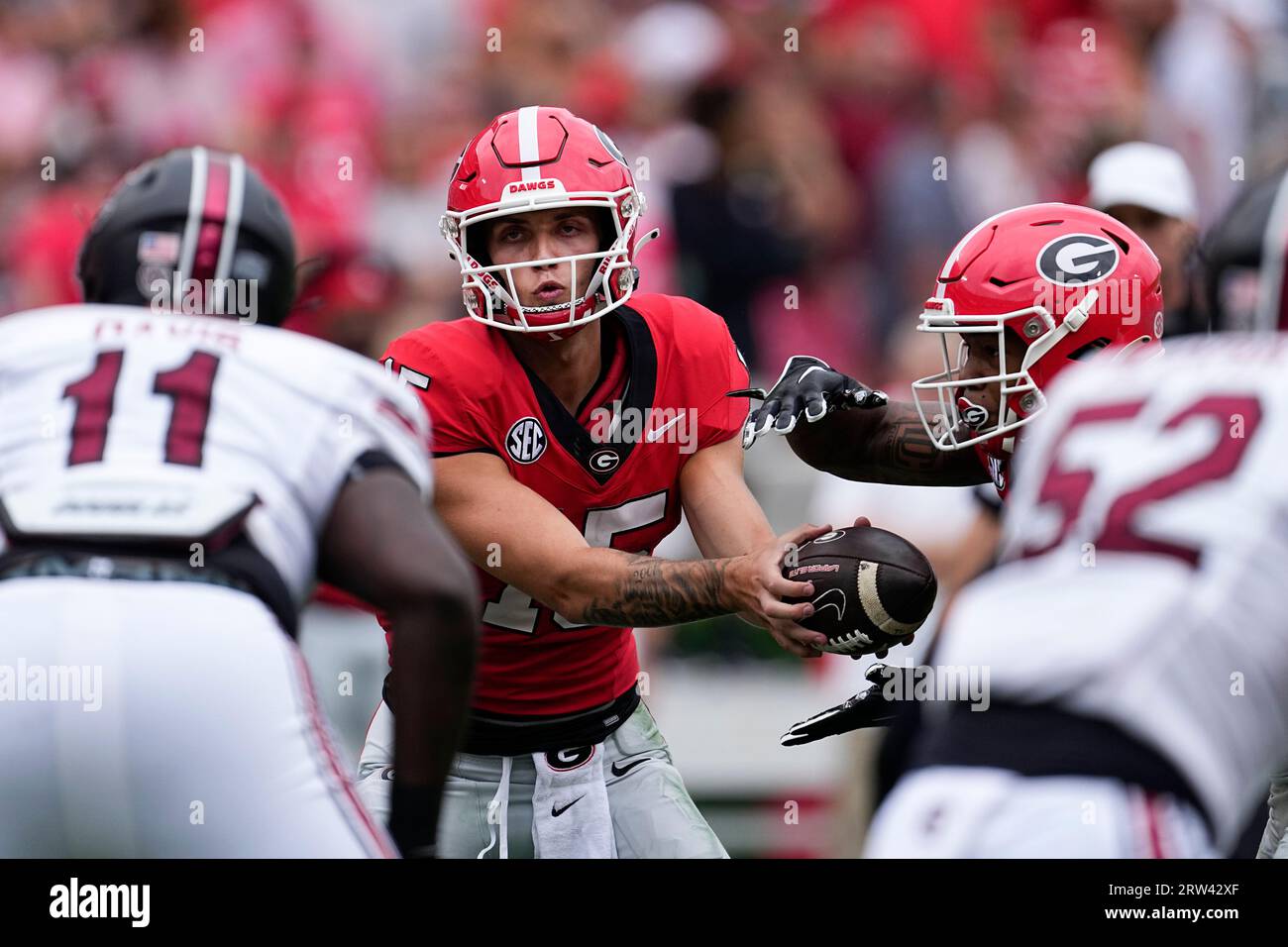 Georgia quarterback Carson Beck (15) hands the ball off during the ...