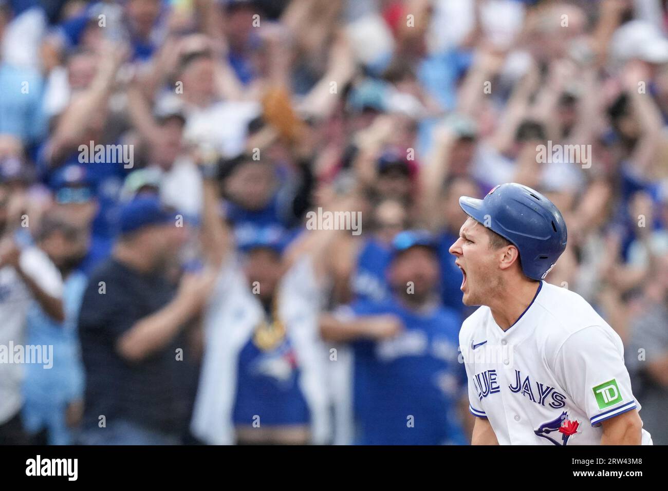 Toronto Blue Jays' Daulton Varsho celebrates after hitting a RBI triple ...