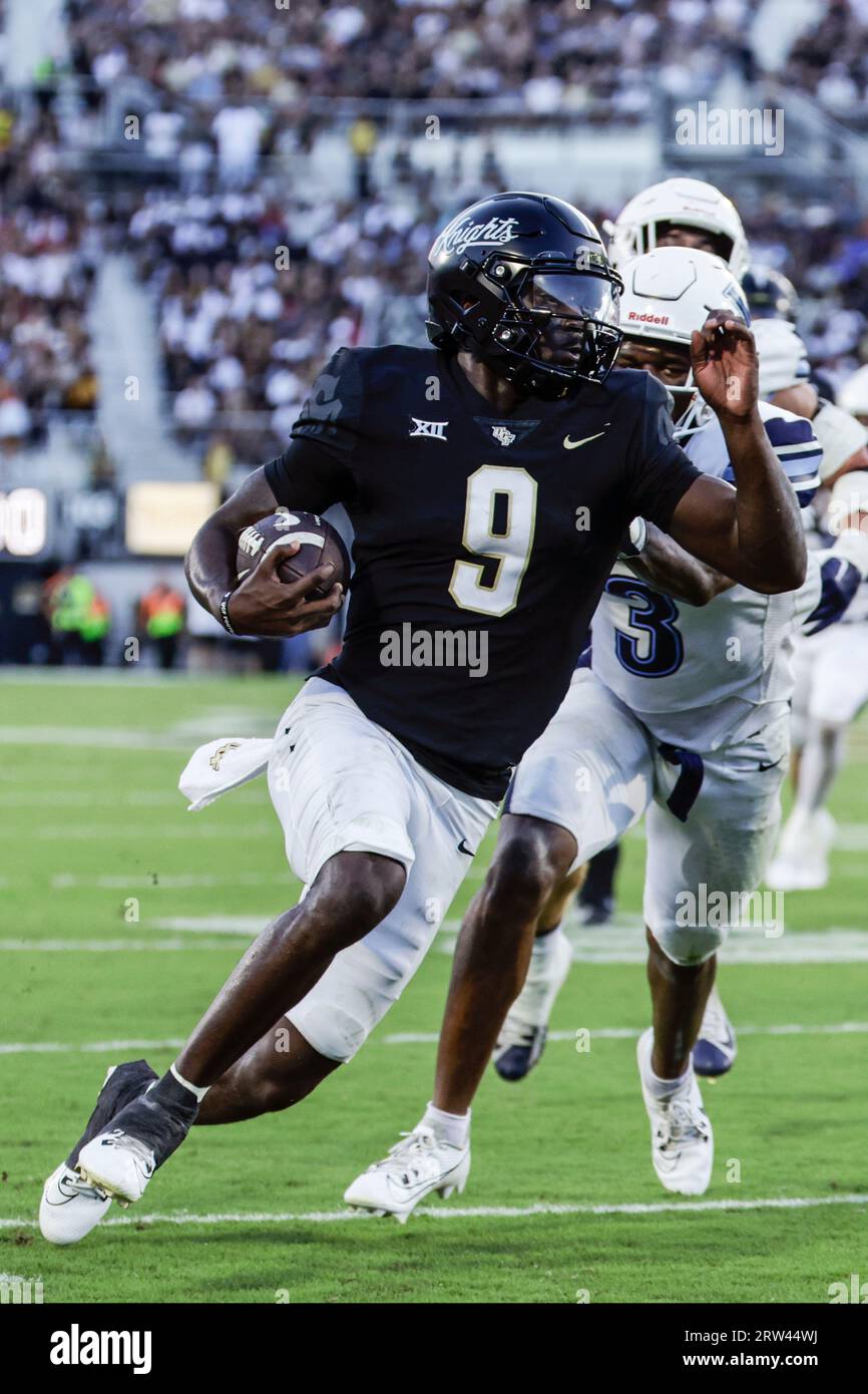UCF Knights quarterback Timmy McClain (9) is pulled down on three years ...