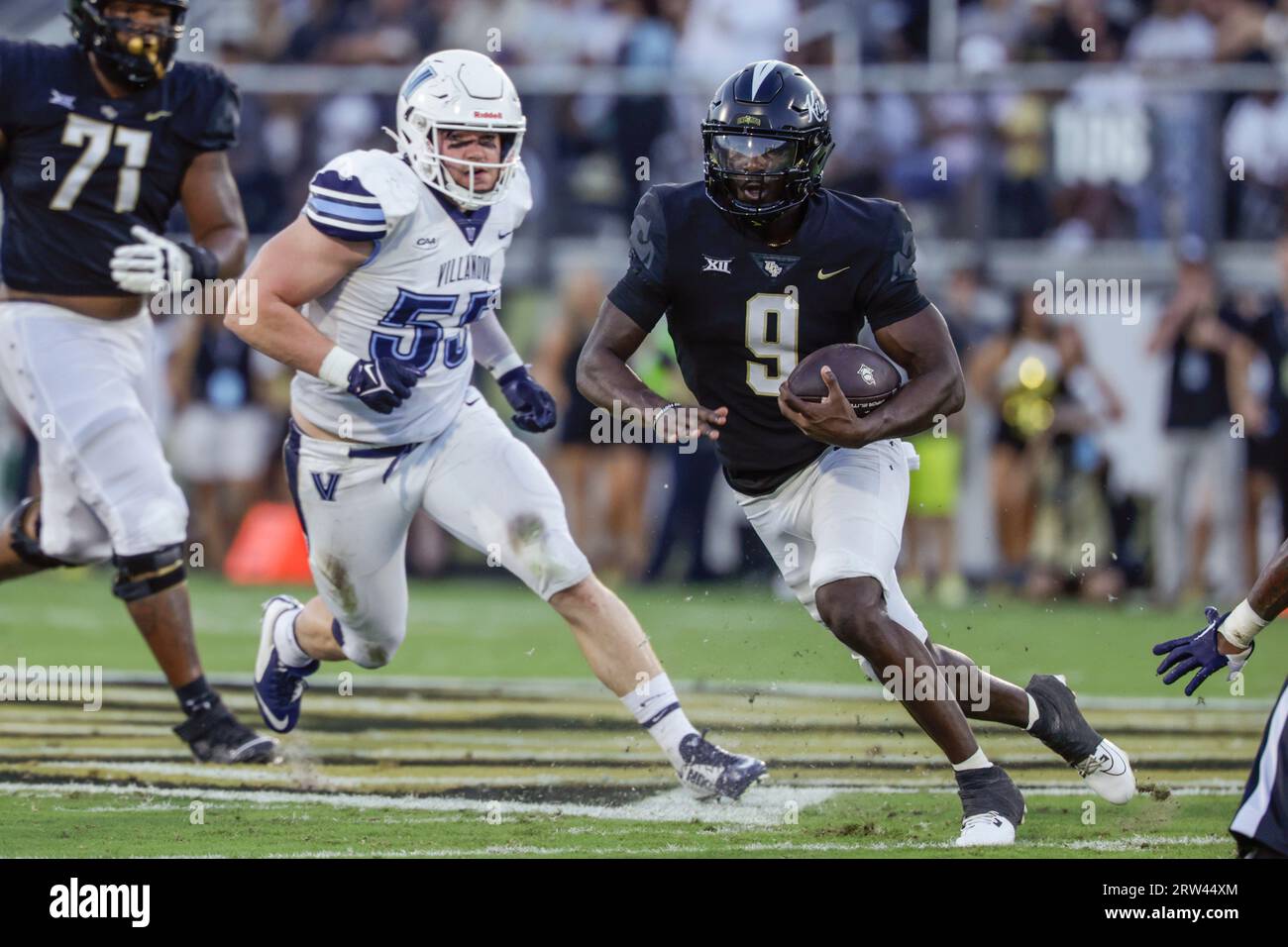 UCF Knights quarterback Timmy McClain (9) runs the ball around ...
