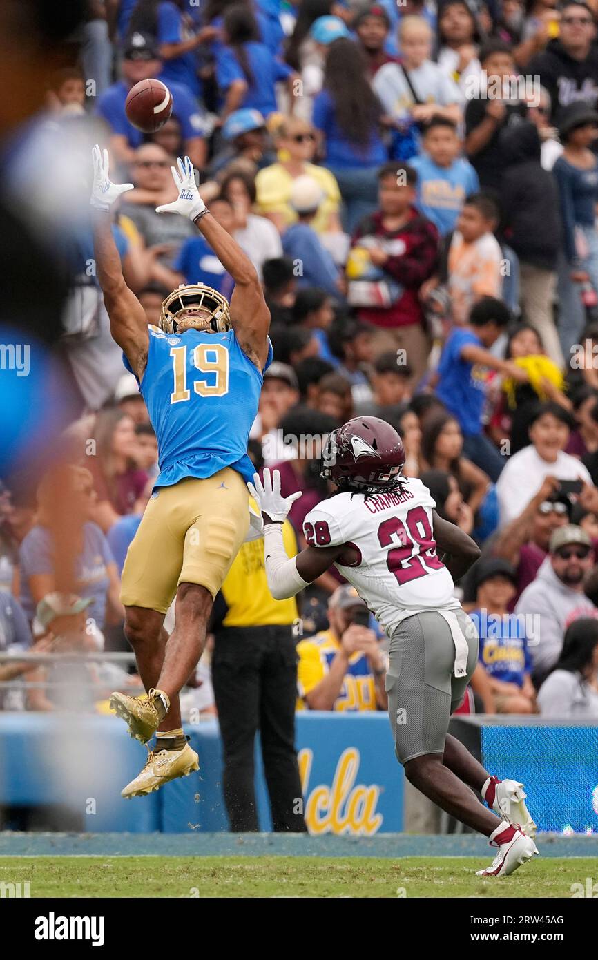 UCLA wide receiver Kyle Ford, left, can't hold on to a pass while under ...