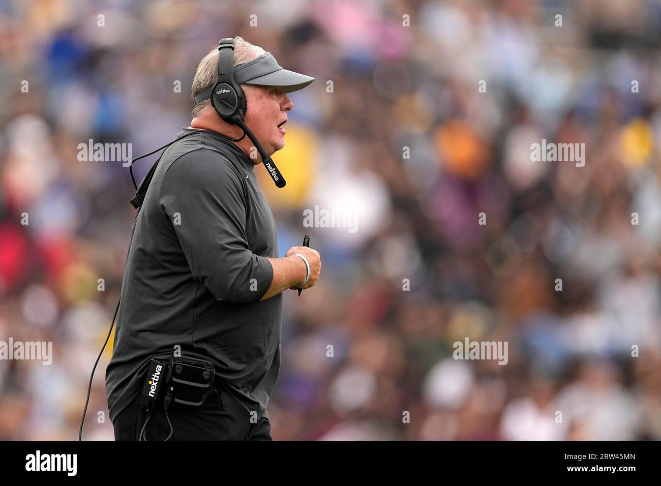 UCLA head coach Chip Kelly stands on the sideline during the first half ...