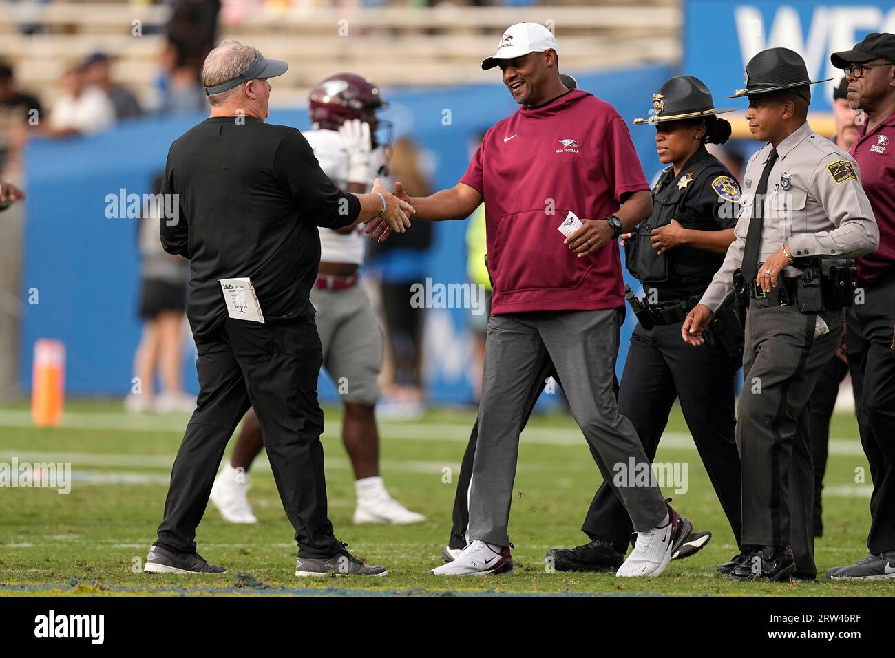 UCLA head coach Chip Kelly, left, and North Carolina Central head coach ...