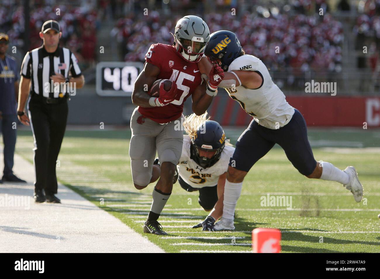 Washington State running back Djouvensky Schlenbaker (15) carries the ...