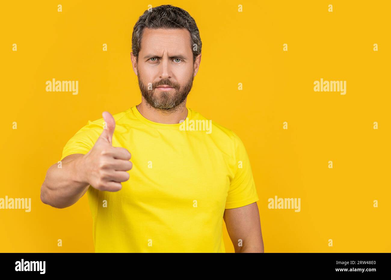 serious man approve in studio, selective focus and copy space. photo of ...