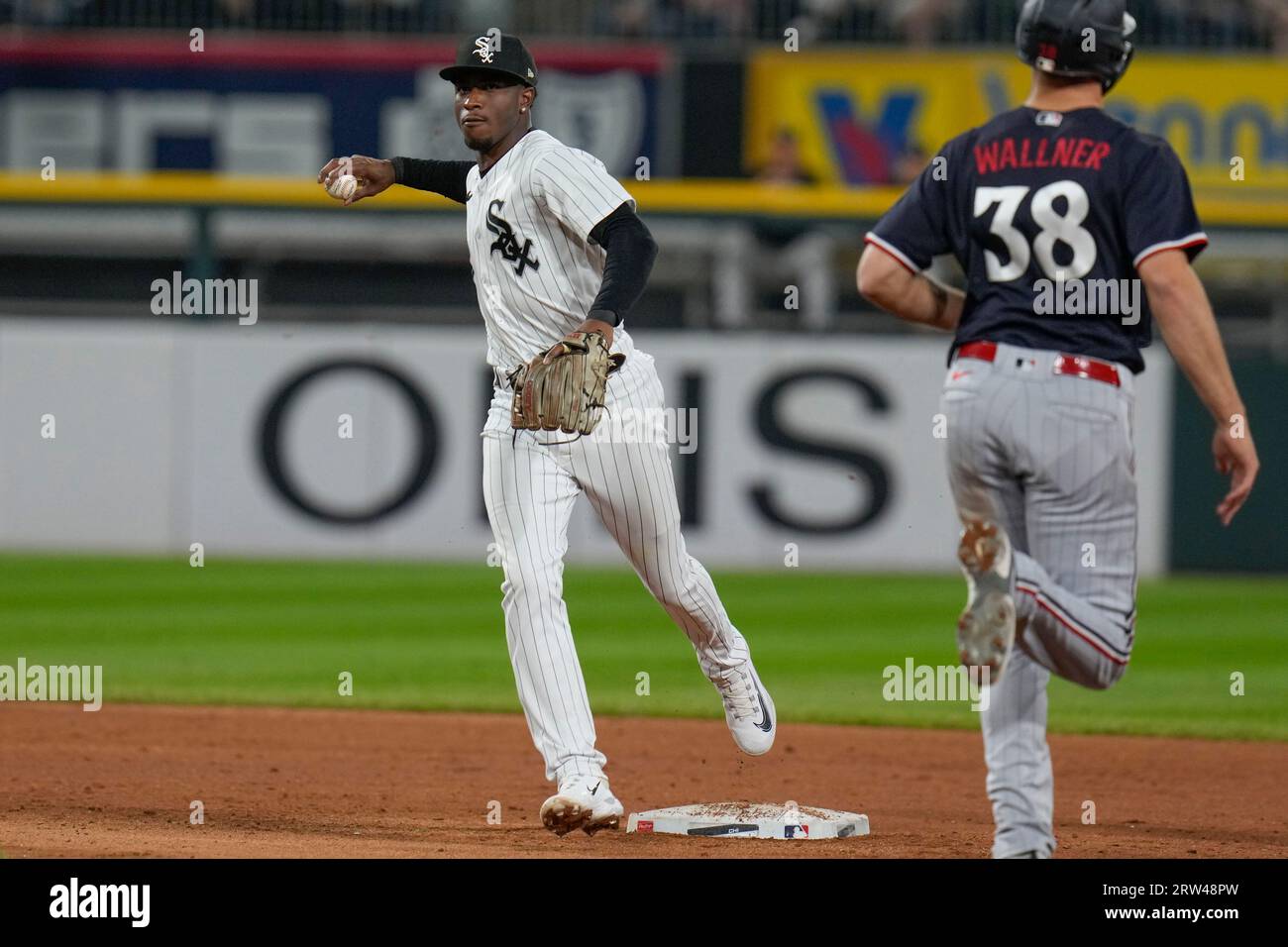 Chicago White Sox shortstop Tim Anderson, left, tags out Minnesota ...