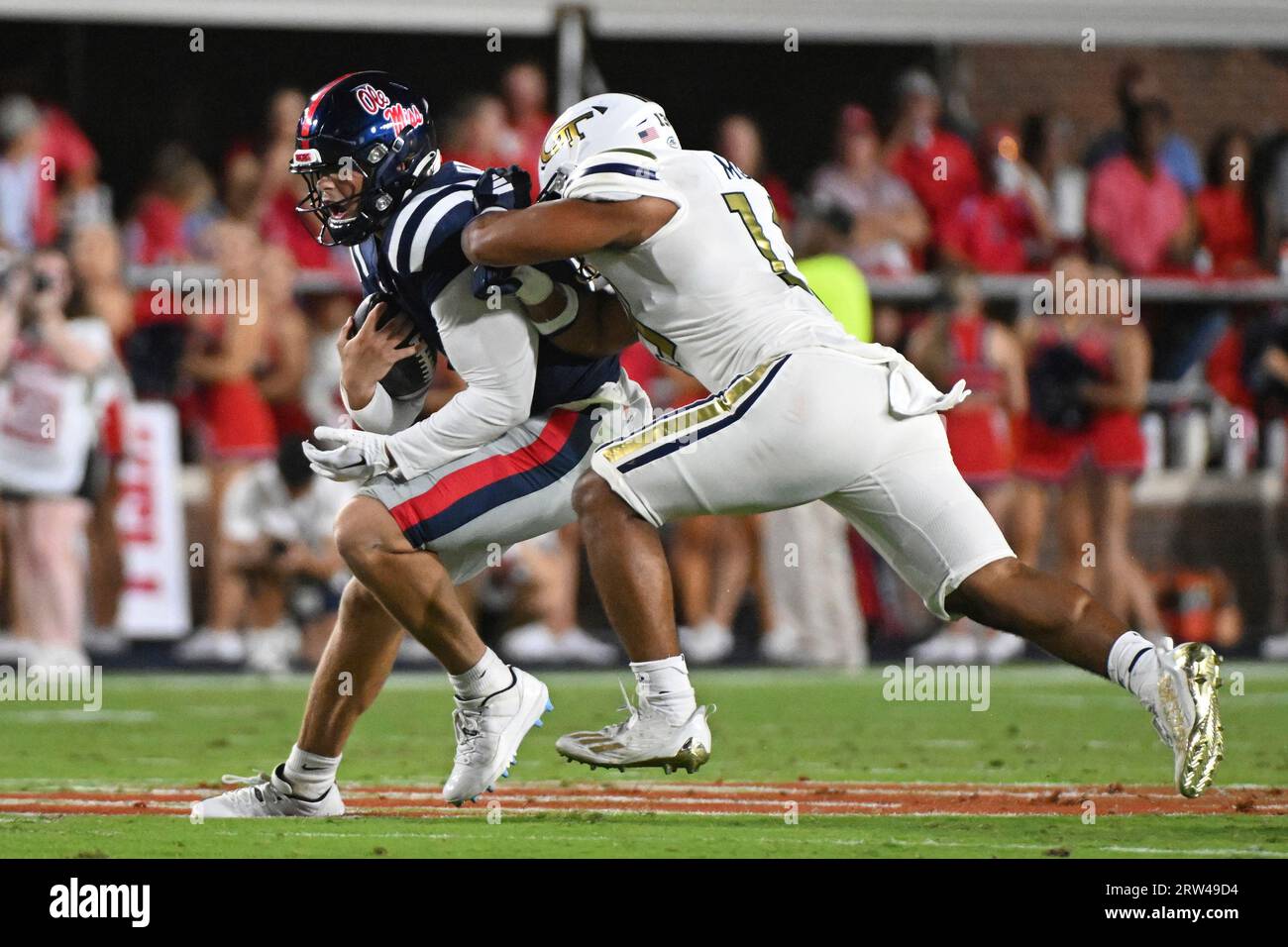 Georgia Tech linebacker Paul Moala (13) tackles Mississippi quarterback ...