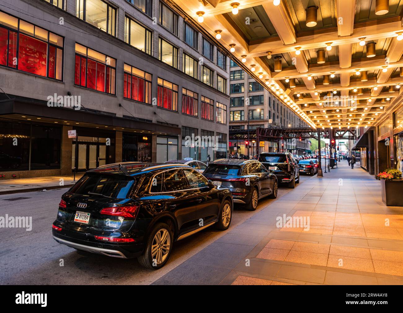 Chicago, USA - April 28, 2023: Cars parked at an illuminated street in ...