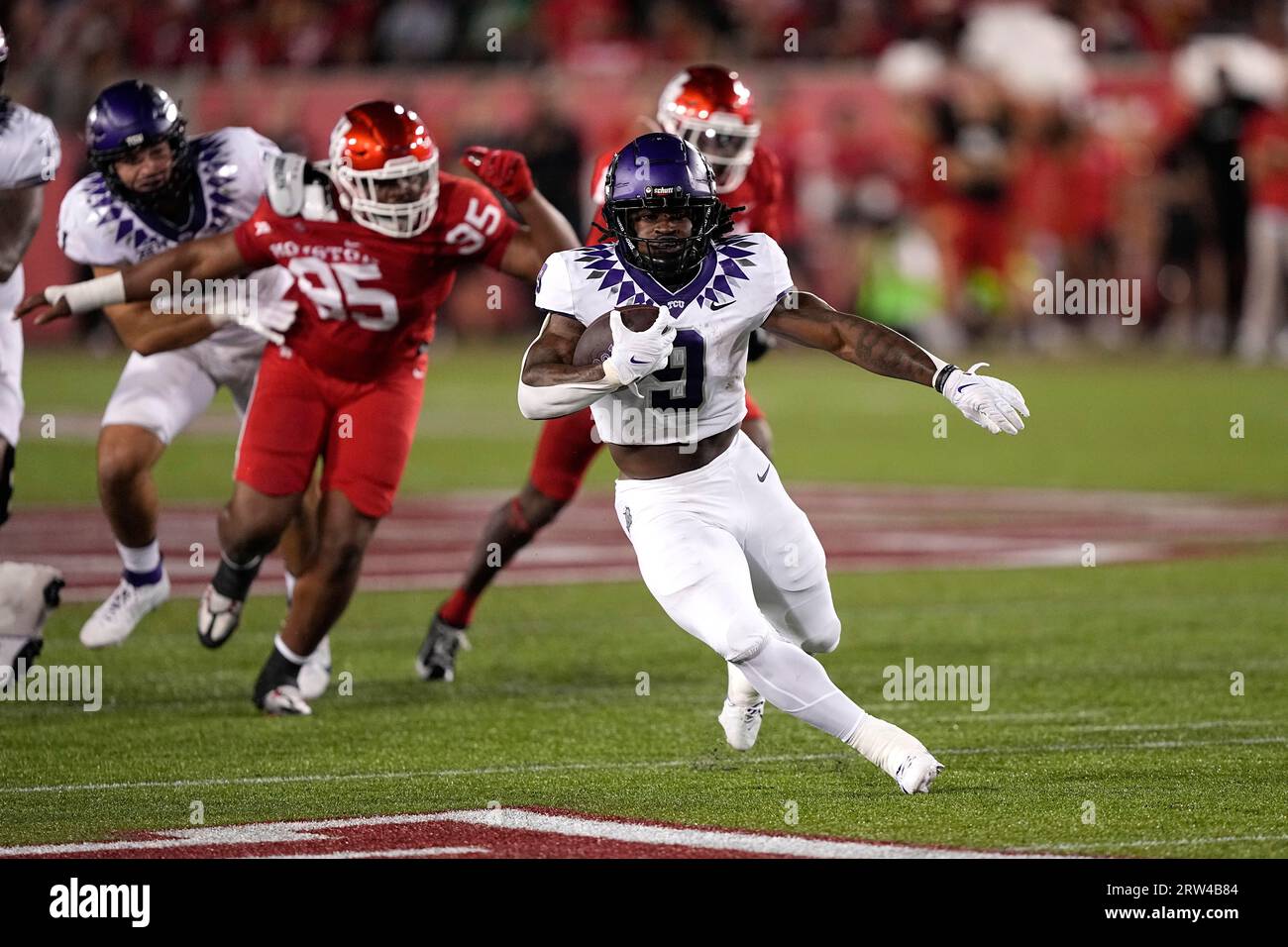 TCU running back Emani Bailey (9) runs for a first down against Houston ...