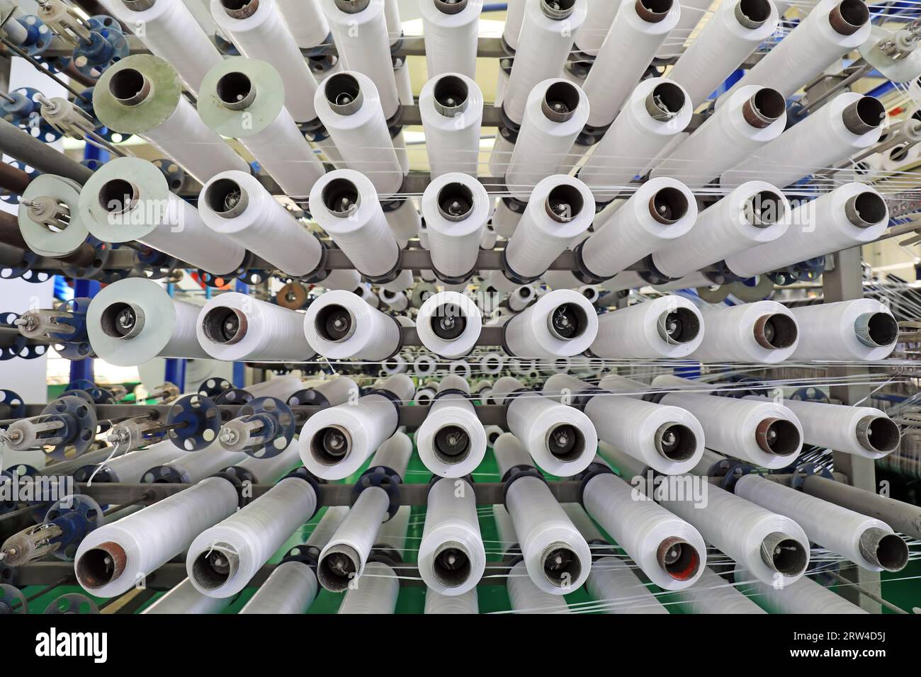Bobbin in the packaging products processing line in a factory, North ...