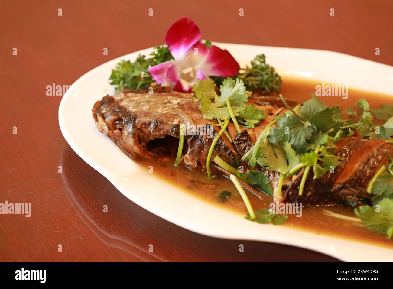 Home stewed pike in a Chinese restaurant Stock Photo - Alamy