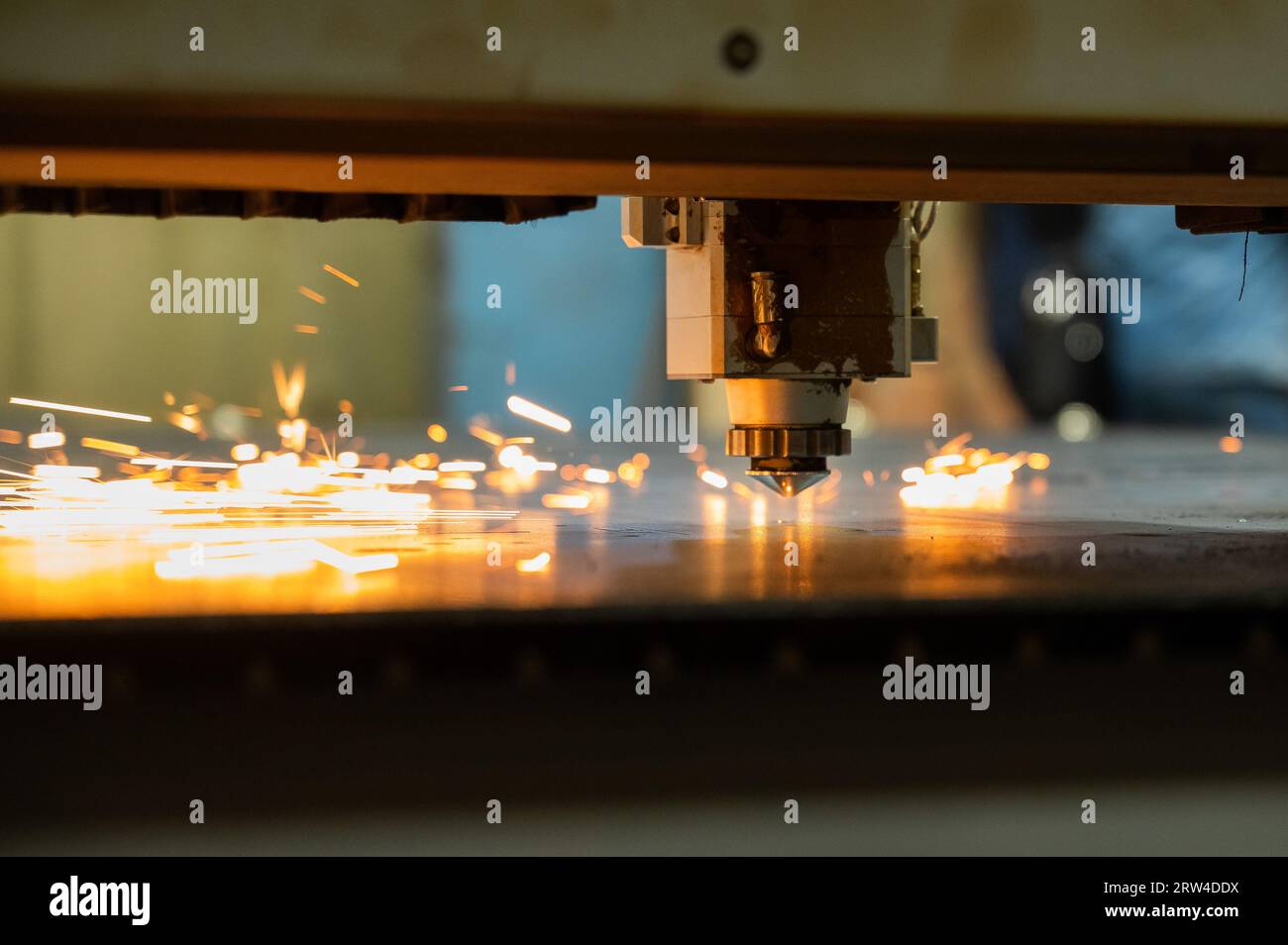 CNC machine. Laser cutting of metal. Sparks Stock Photo - Alamy