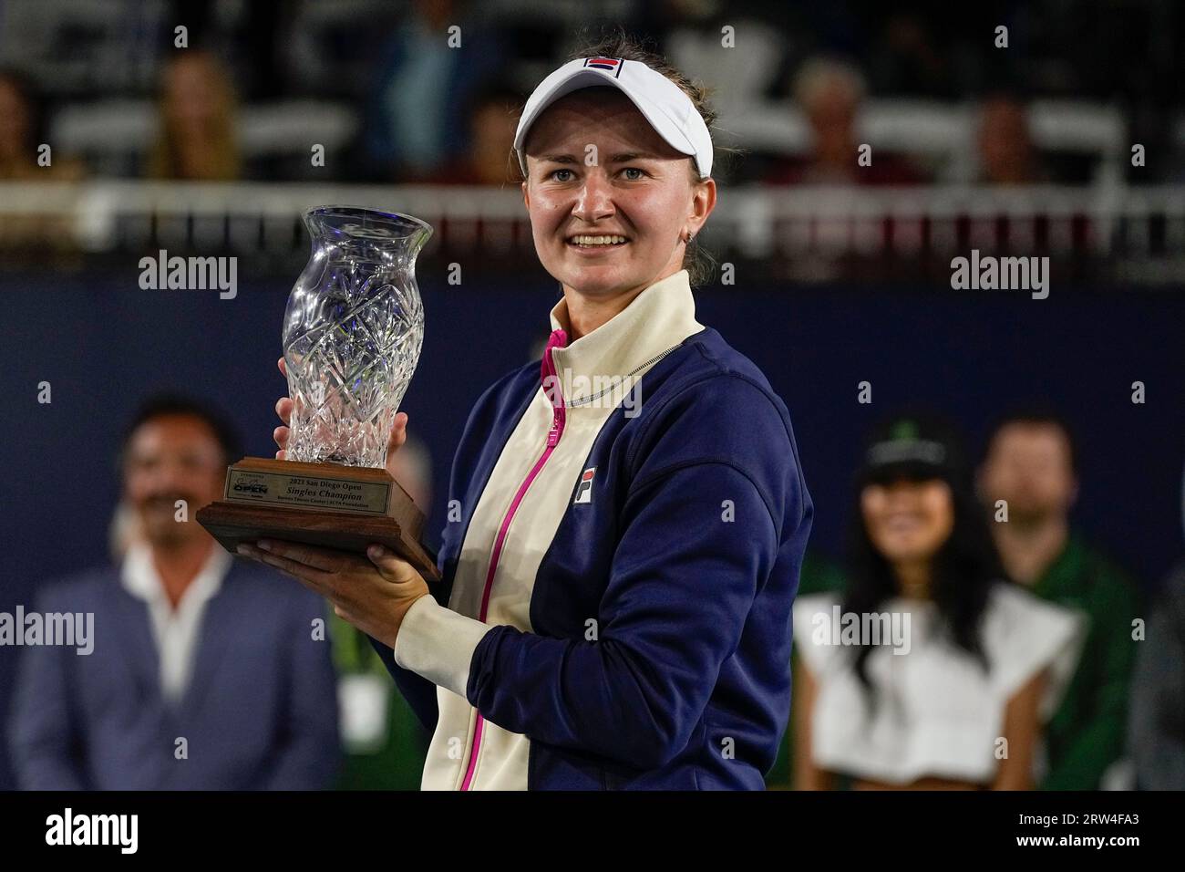 Barbora Krejcikova, of the Czech Republic, holds the trophy after defeating Sofia Kenin, of the ...
