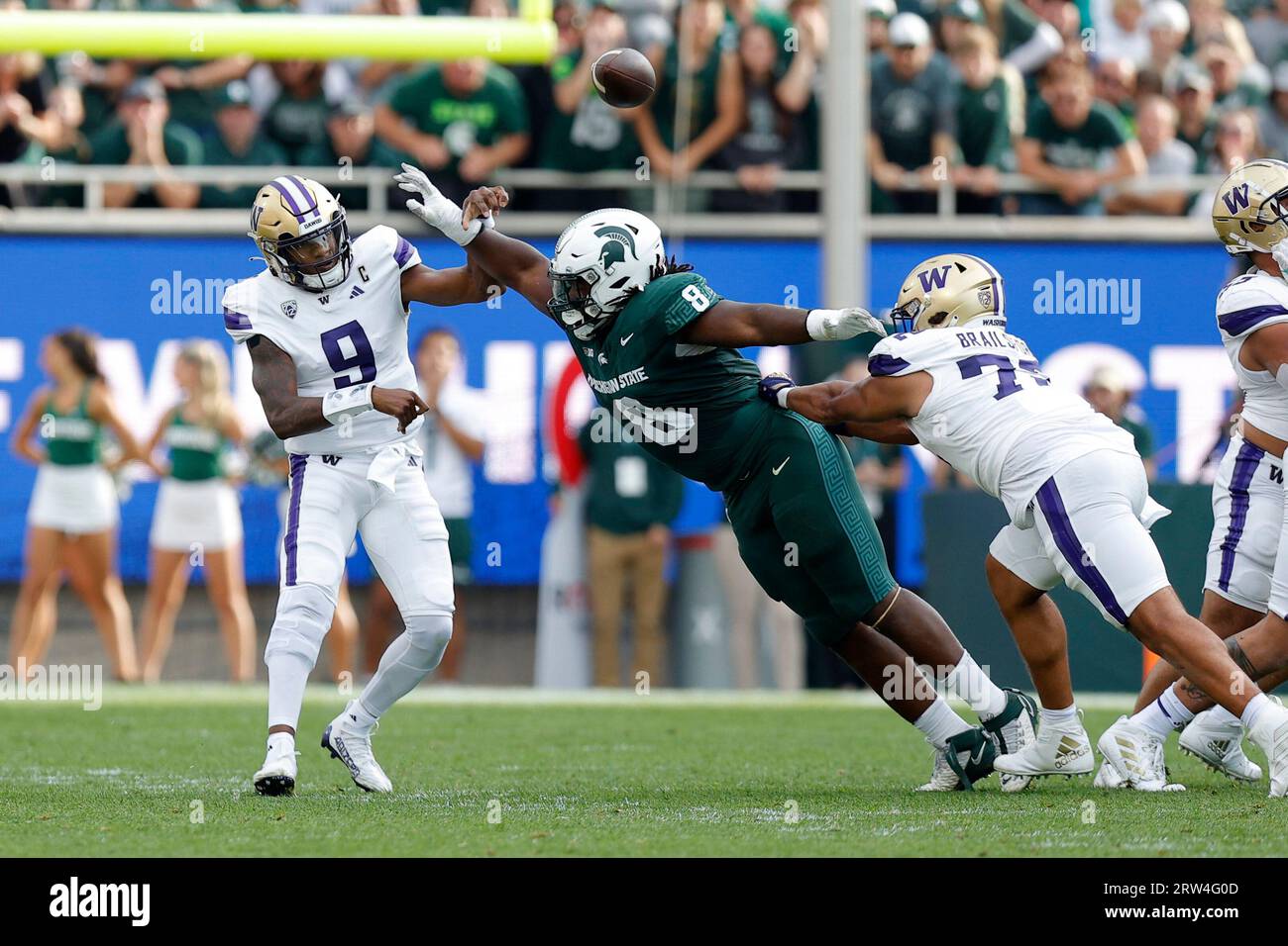 Washington quarterback Michael Penix Jr., left, throws a pass against ...