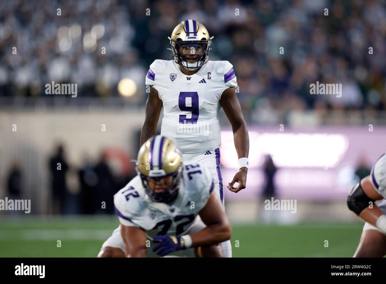 Washington quarterback Michael Penix Jr. (9) lines up behind center ...