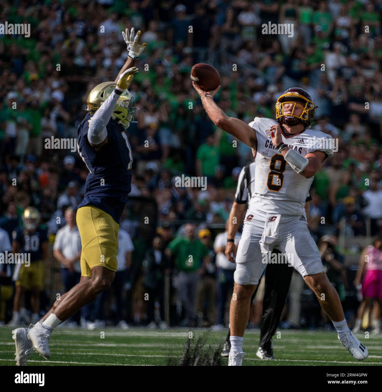 Central Michigan quarterback Jase Bauer (8) makes a pass under pressure ...