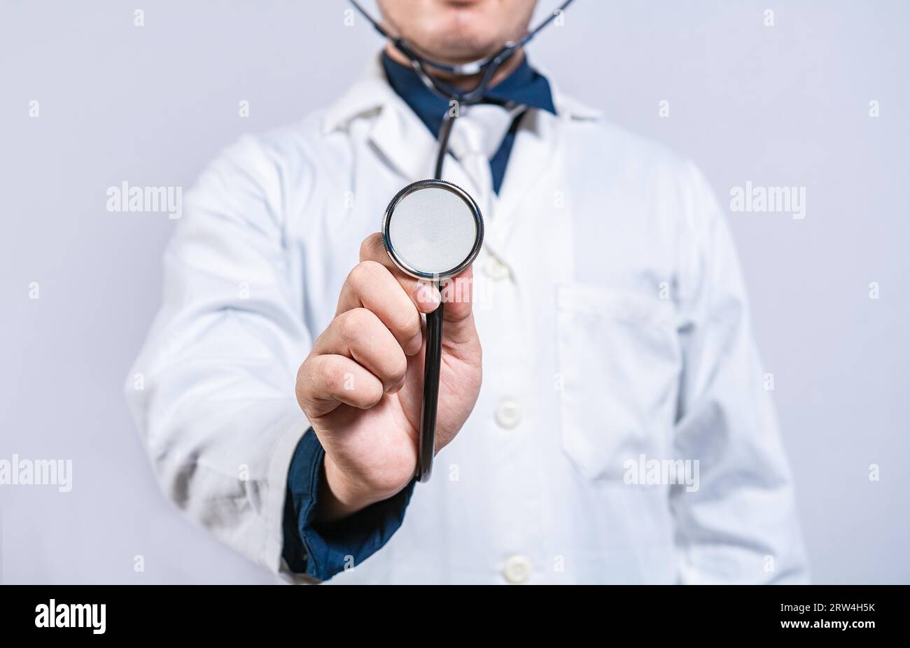 Close up of doctor showing stethoscope medical isolated. Unrecognizable ...