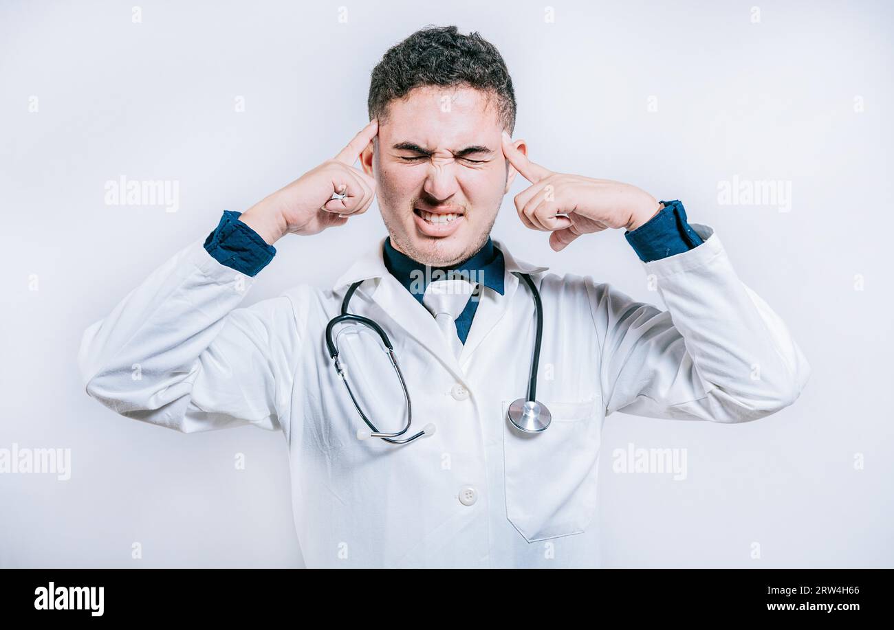 Doctor with migraine holding his head. Fatigued doctor with headache ...