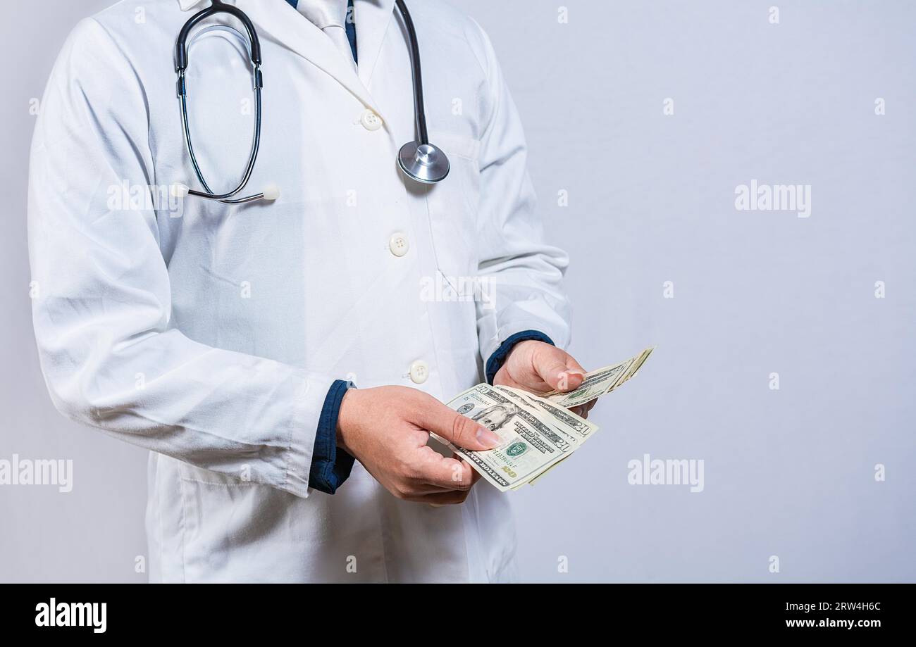 Medical corruption concept. Corrupt doctor counting money isolated ...