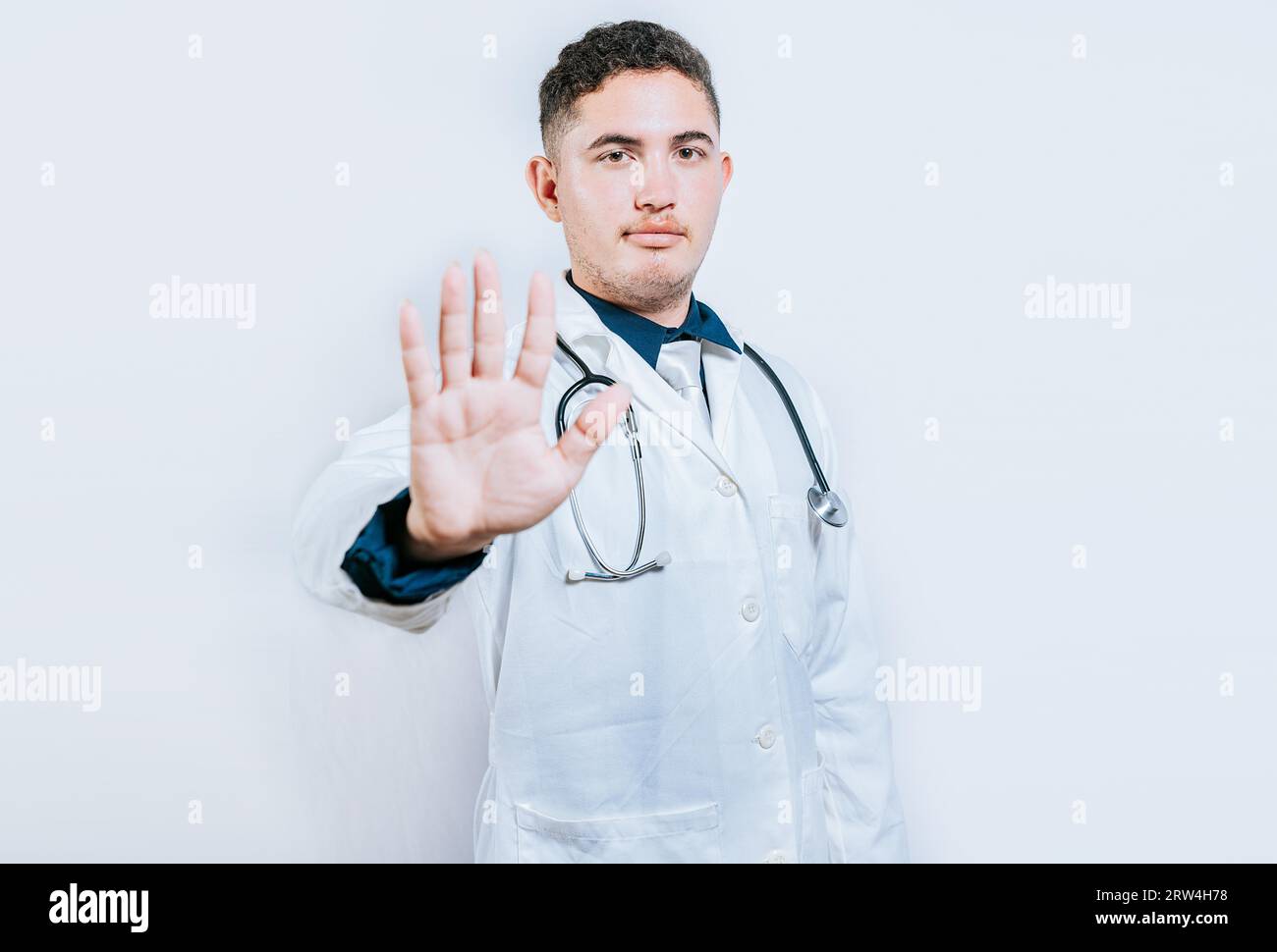 Young doctor counting number 5 on isolated background. Doctor counting ...