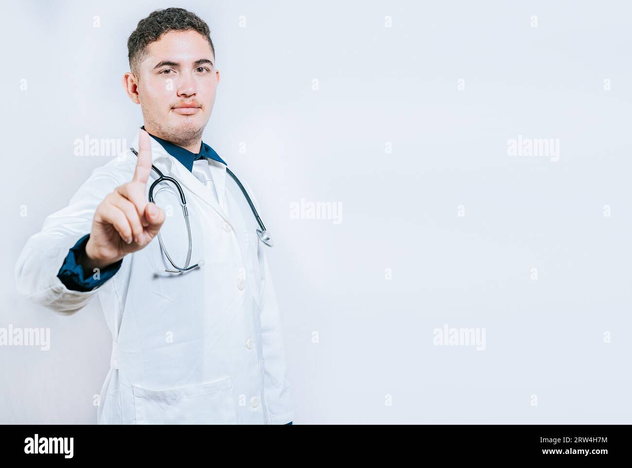 Doctor counting number ONE isolated. Handsome doctor counting number 1 ...