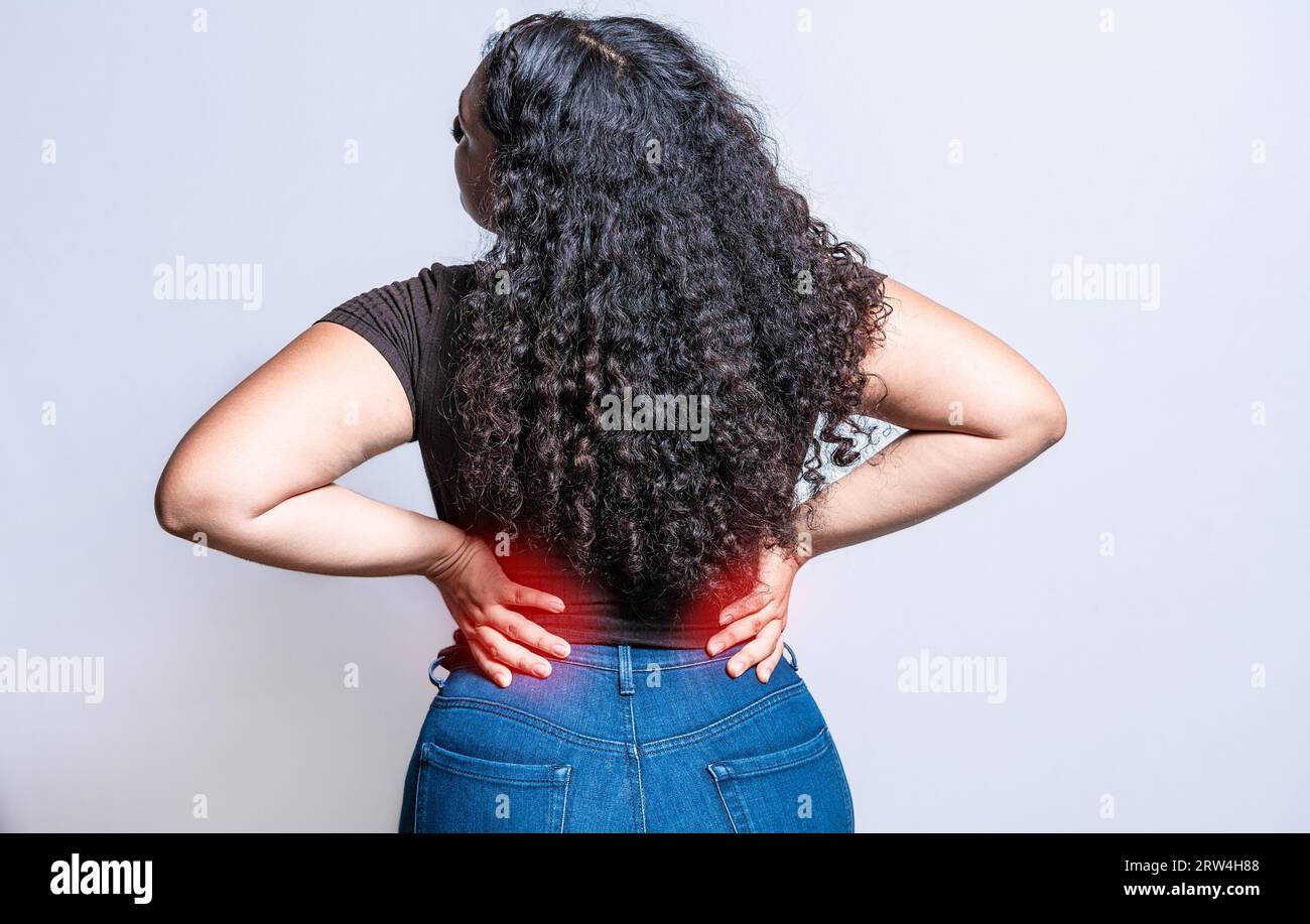 People with spine problems. Woman with back pain on isolated background ...