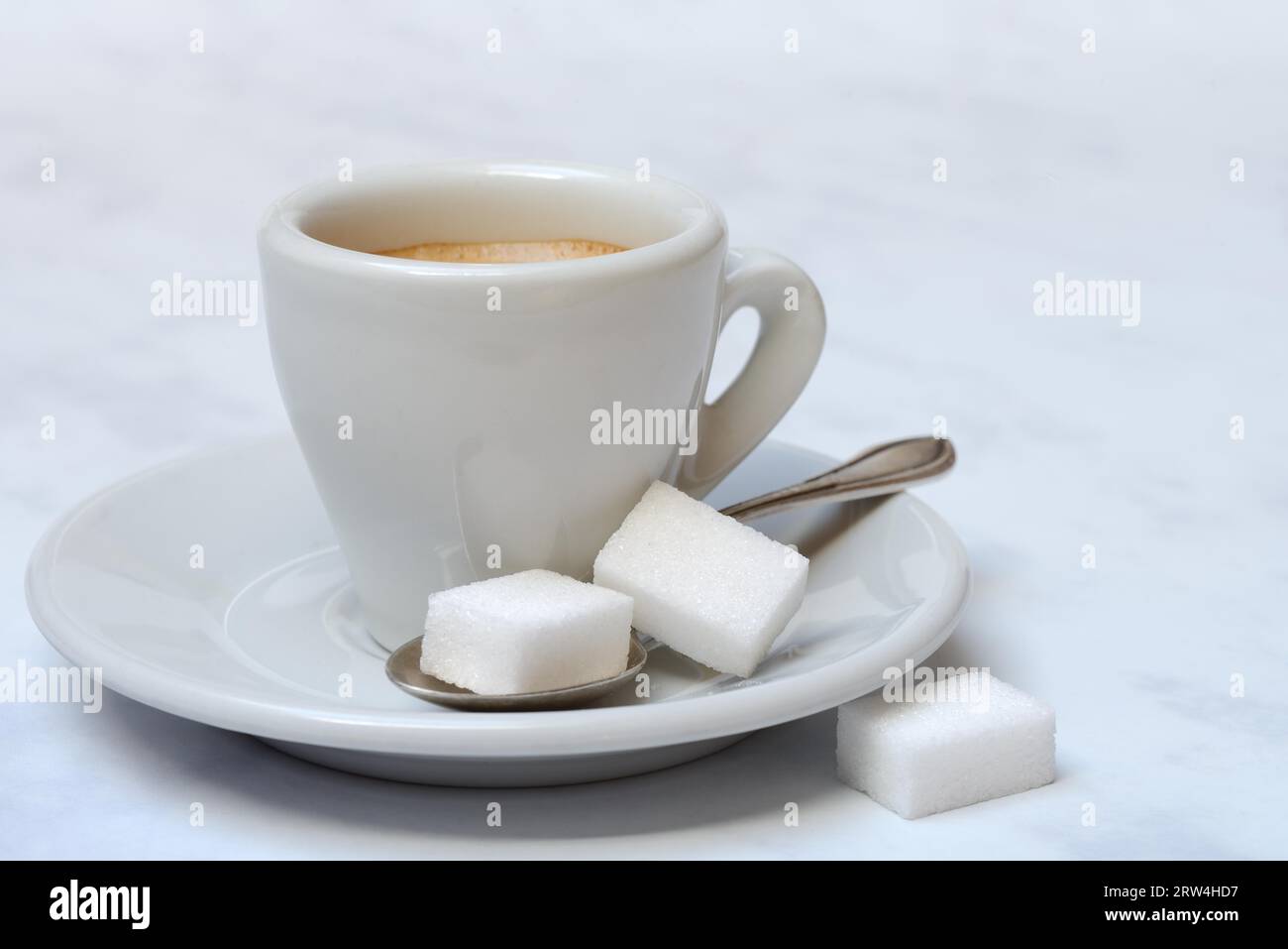 Espresso Cup with Sugar Cube Stock Photo - Alamy