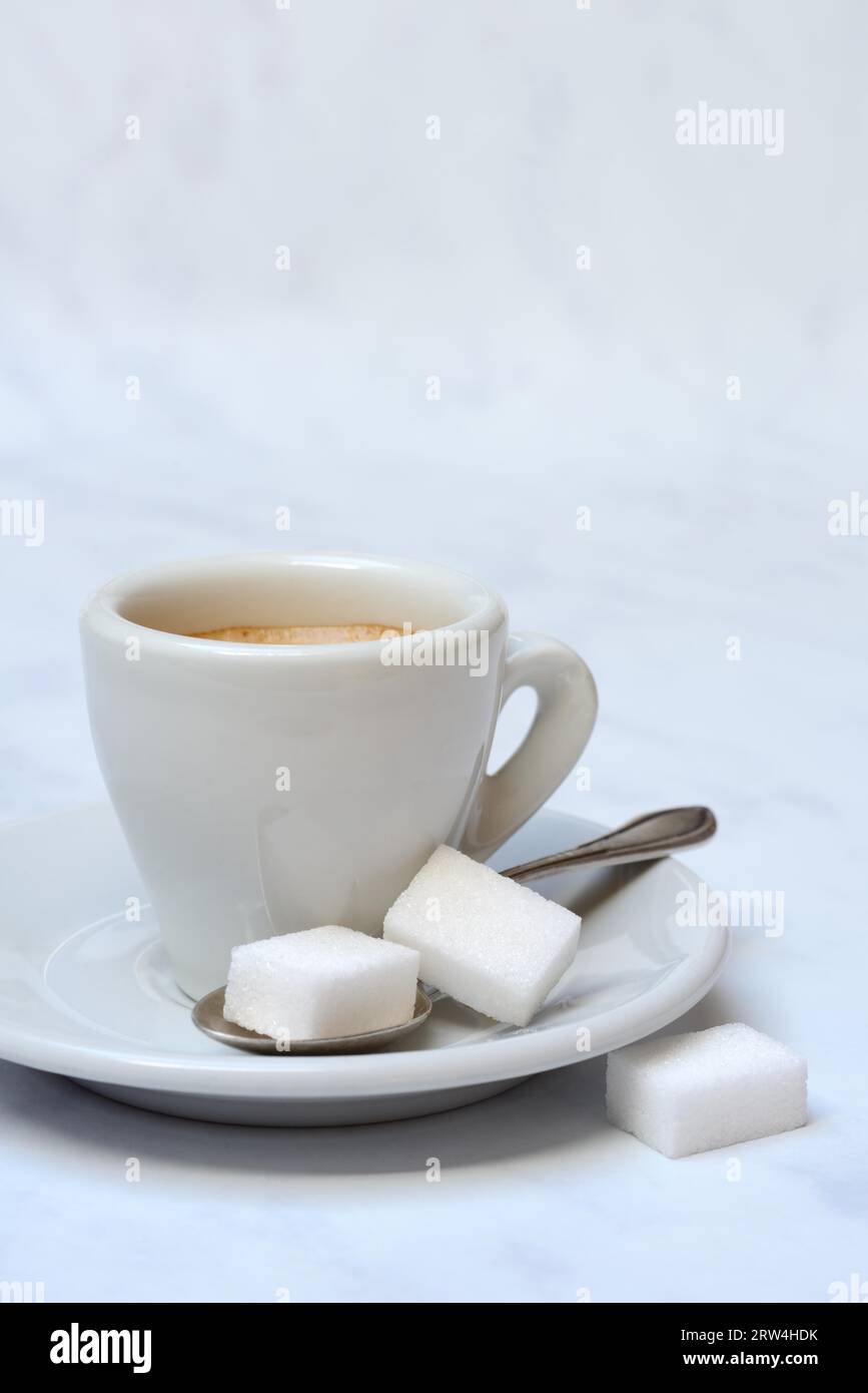 Espresso Cup with Sugar Cube Stock Photo - Alamy
