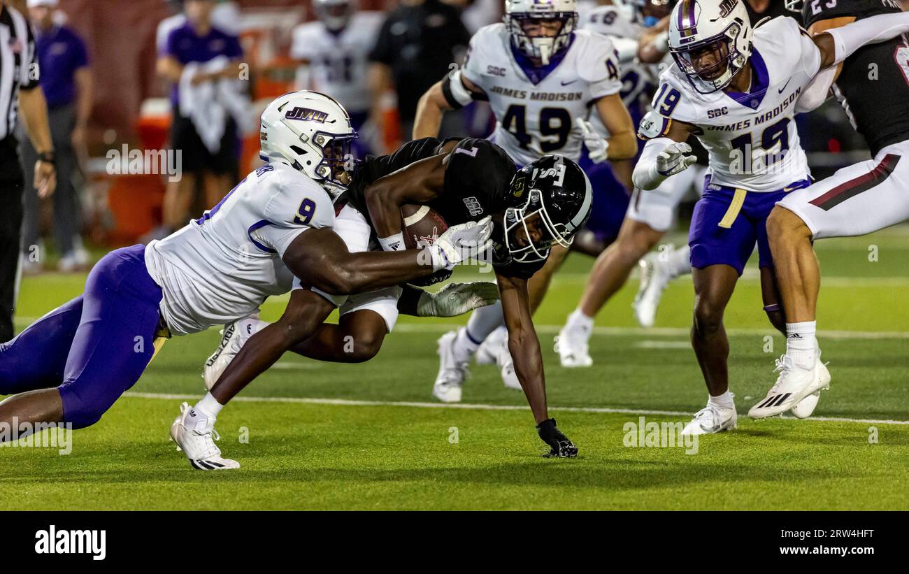 James Madison defensive lineman Jamree Kromah (9) tackles Troy wide ...
