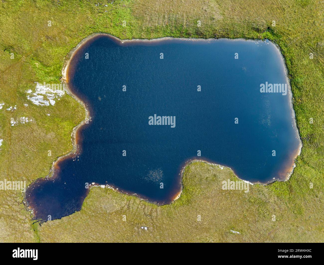 Aerial view, top down view of a bog pond at Loch Stack in the Northern ...